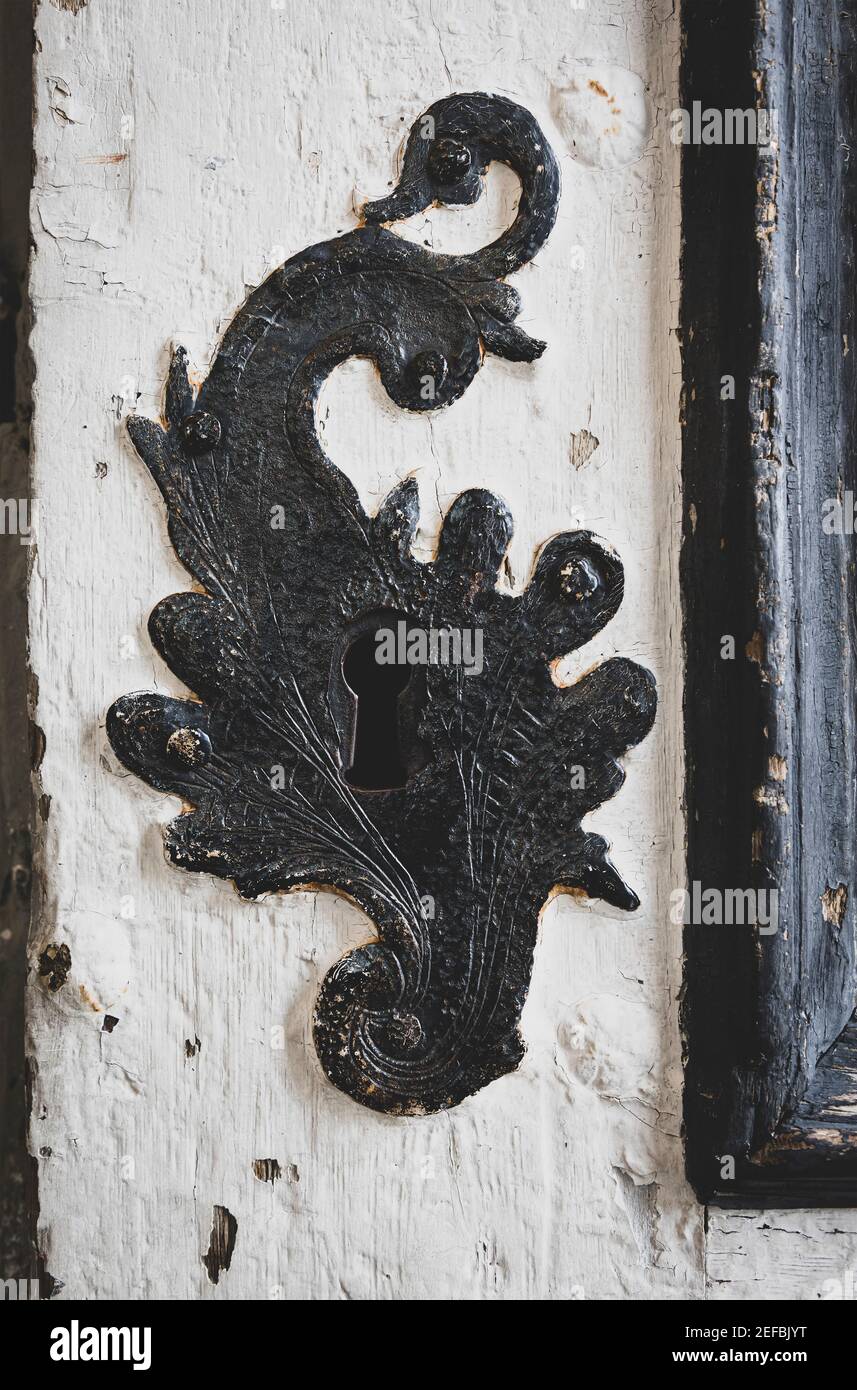 Detail of wooden door with iron key hole Stock Photo - Alamy