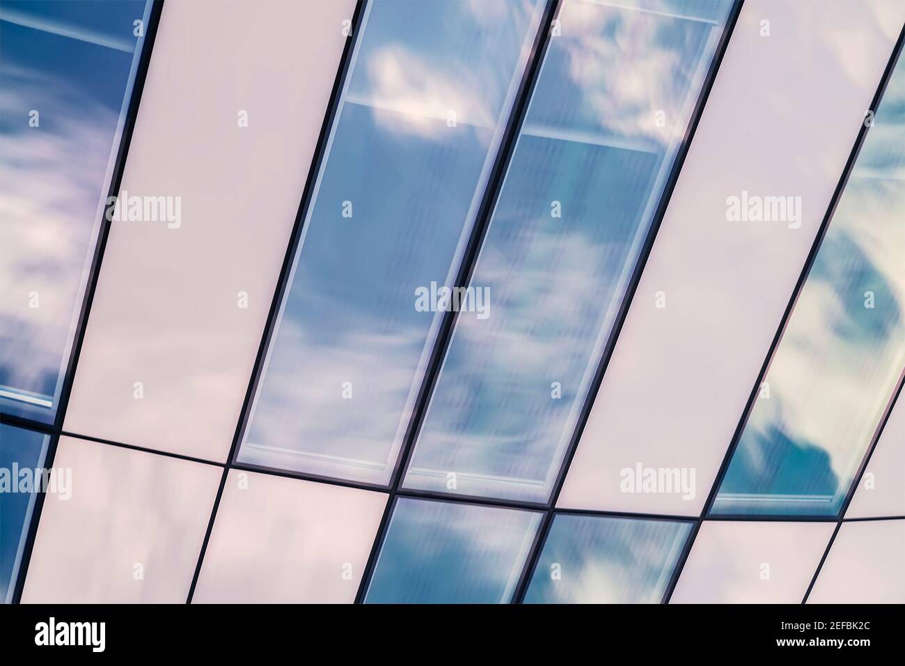 Detail of modern architecture with blue sky and window reflections ...