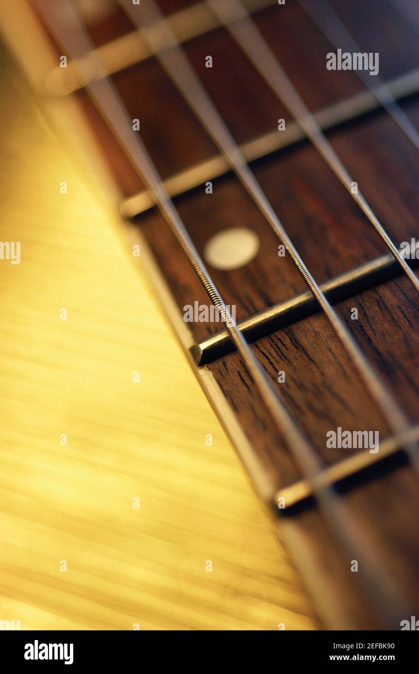 Close-up of handle and strings of electric guitar Stock Photo - Alamy