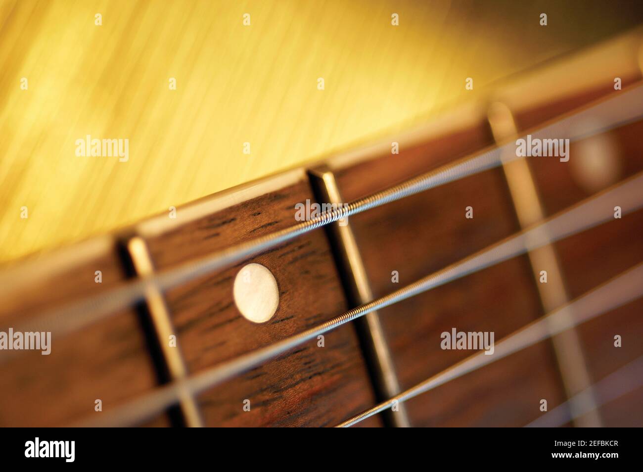 Close-up of handle and strings of electric guitar Stock Photo - Alamy