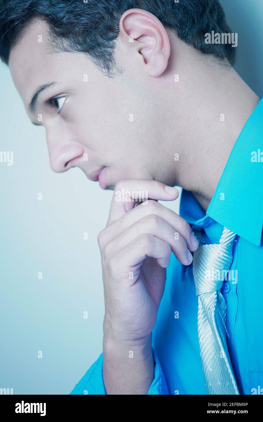 Side profile of a businessman thinking Stock Photo - Alamy