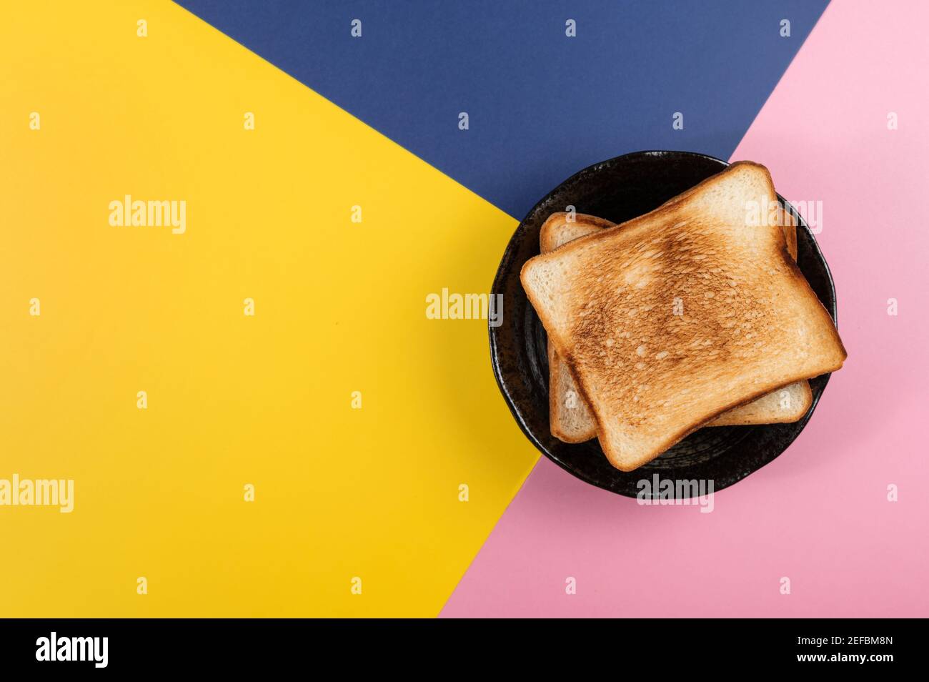 baked bread on three colors(blue,pink,yellow) background Stock Photo ...