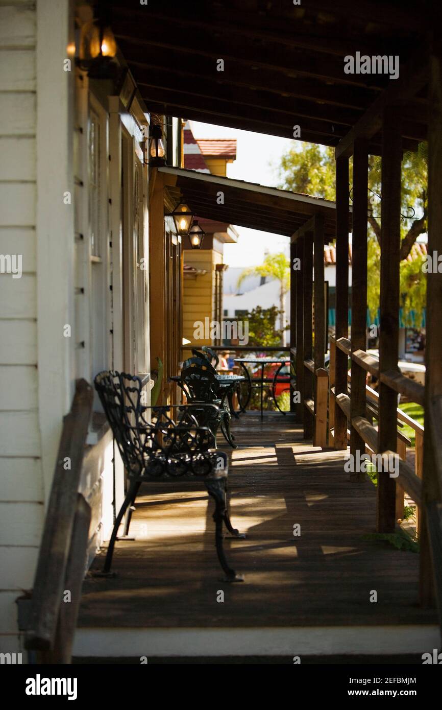 Side profile of a bench on a porch Stock Photo - Alamy