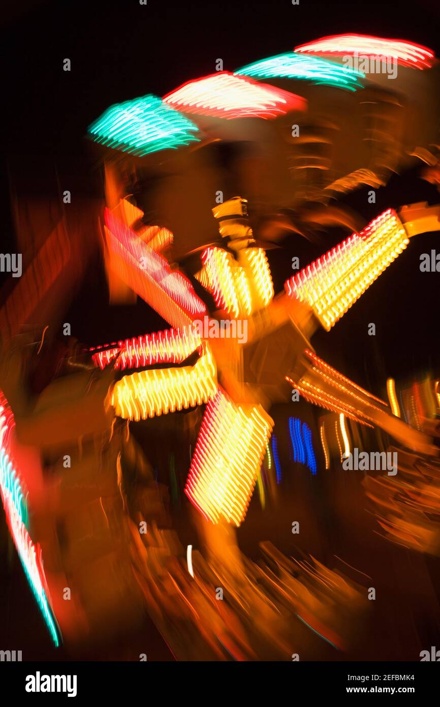 Lights glowing on a carnival ride at night, California, USA Stock Photo ...