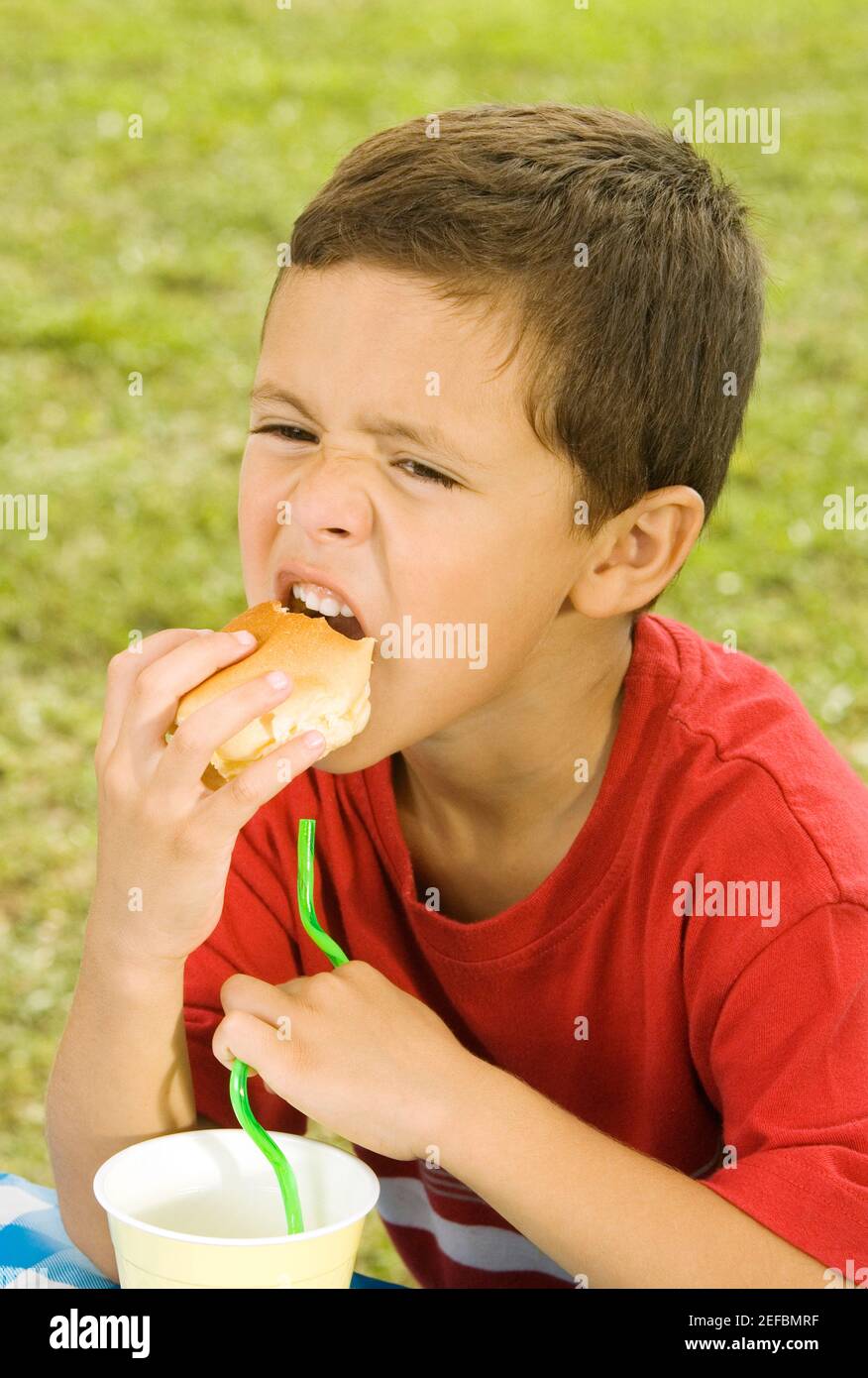 Kid eating burger school hi-res stock photography and images - Alamy