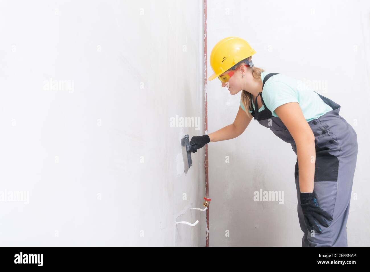 Preparing concrete wall in new house for plastering and leveling ...