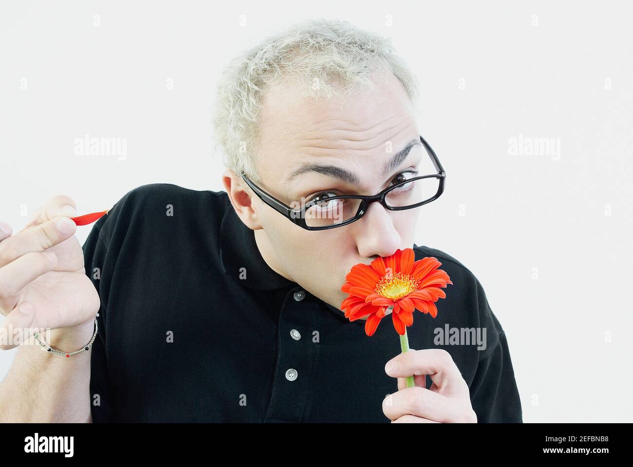 Man sniffing a flower hi-res stock photography and images - Alamy