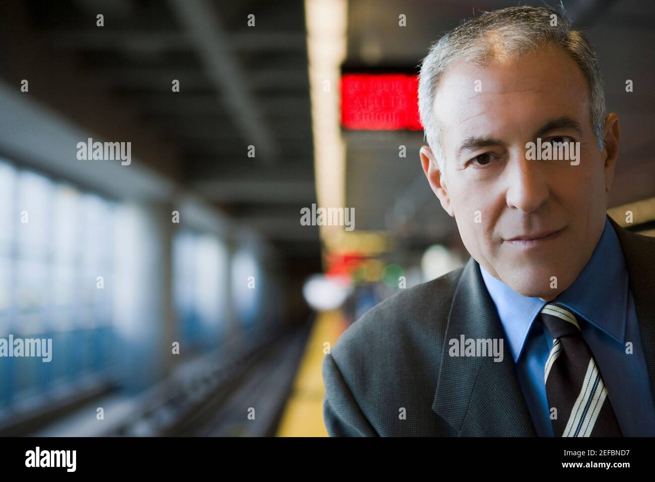 Portrait of a businessman grinning Stock Photo - Alamy
