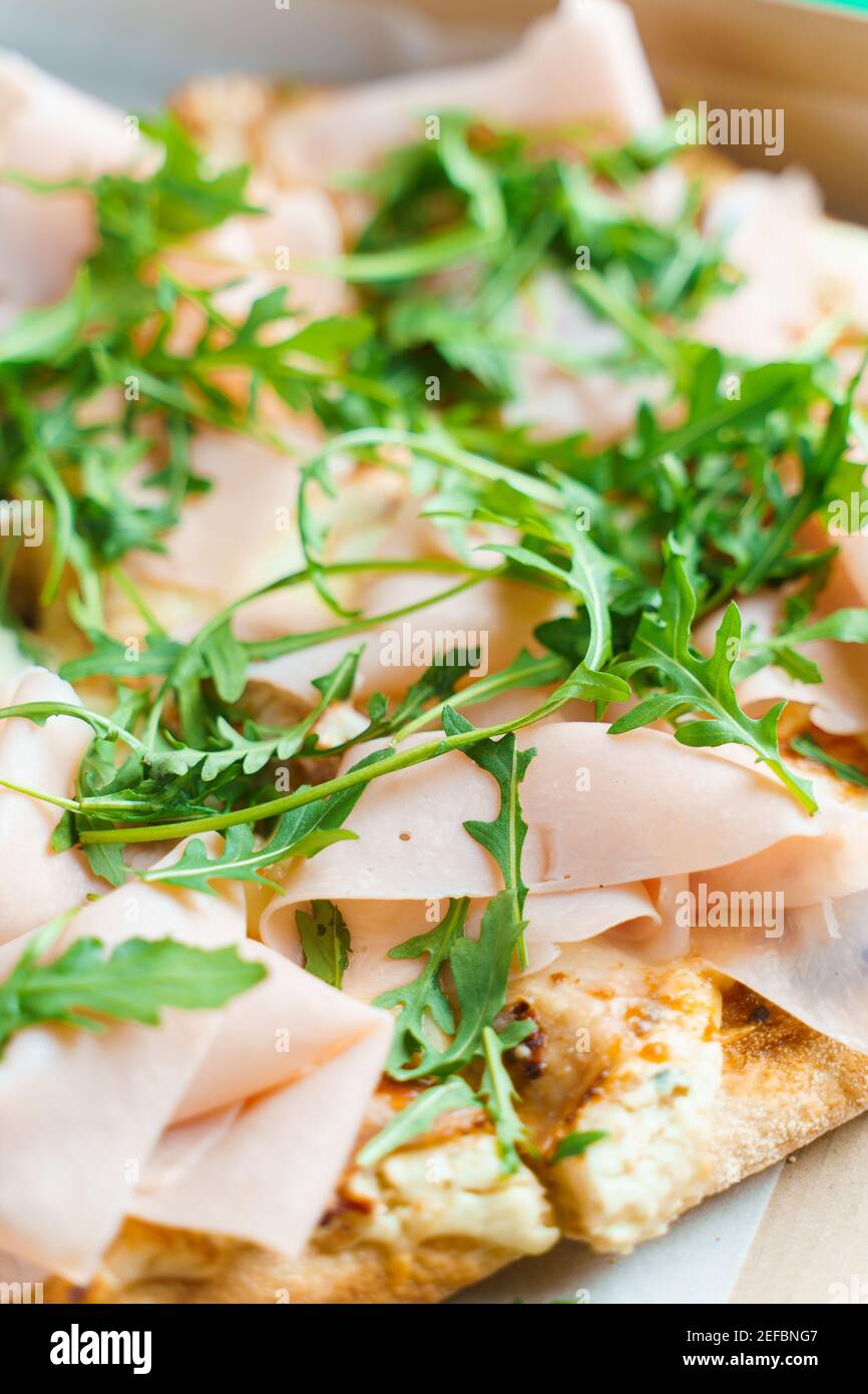 Pinsa romana with pear, cheese, prosciutto in delivery box ...