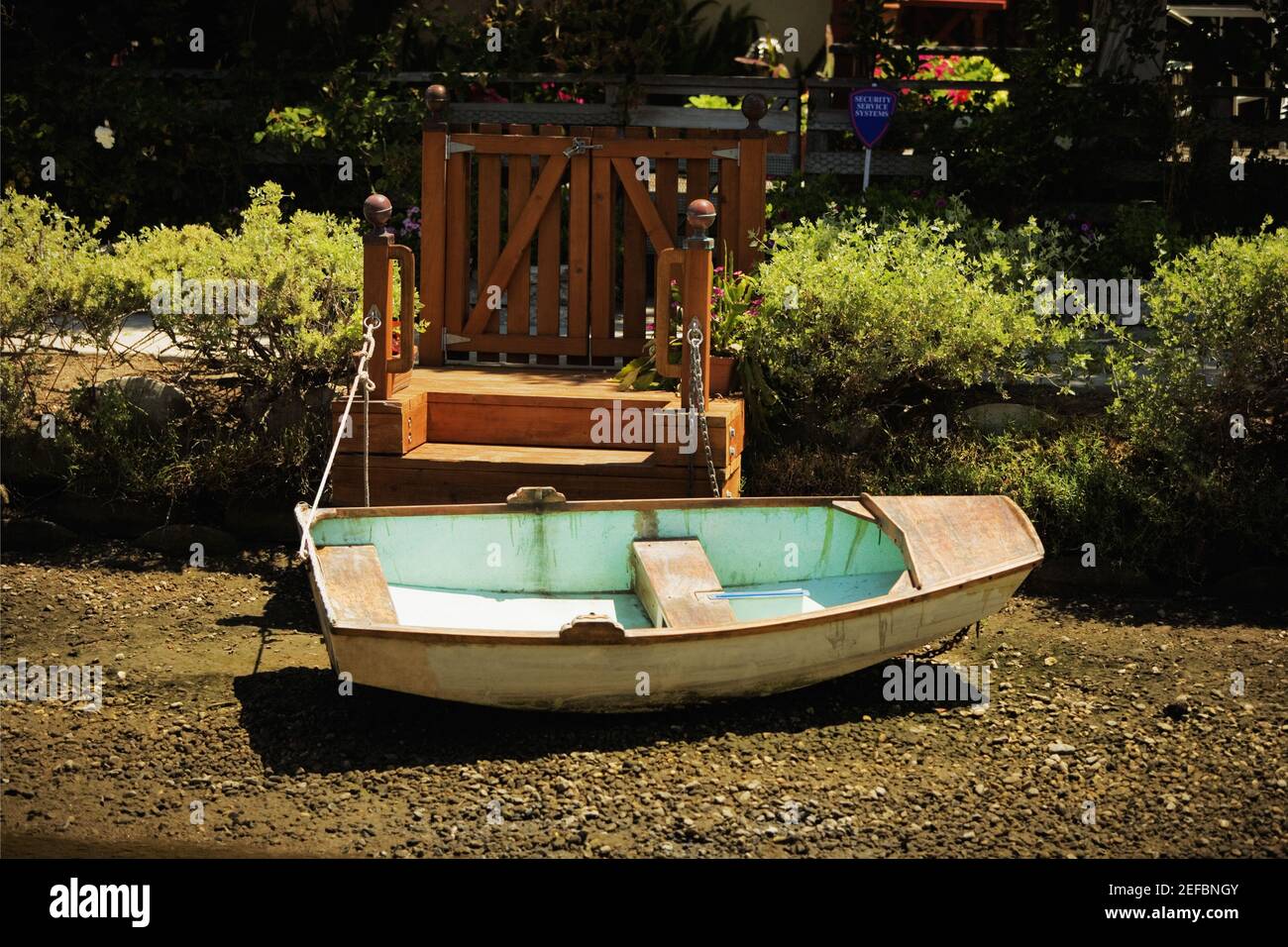 Side profile of a rowboat on a shore Stock Photo - Alamy