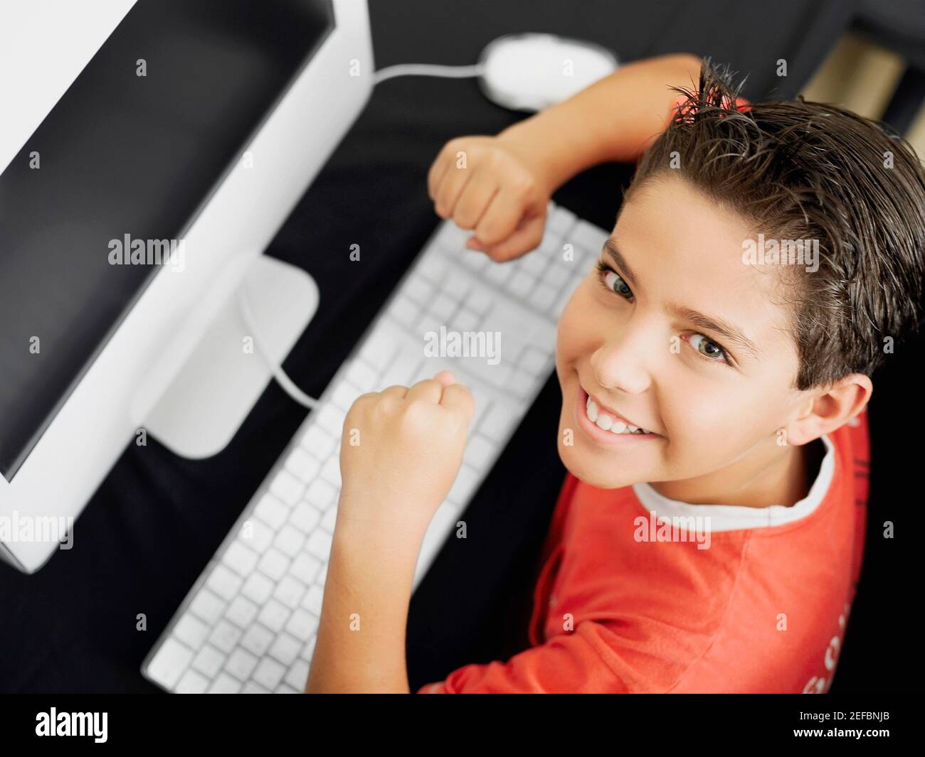 Portrait of a boy with a computer Stock Photo - Alamy
