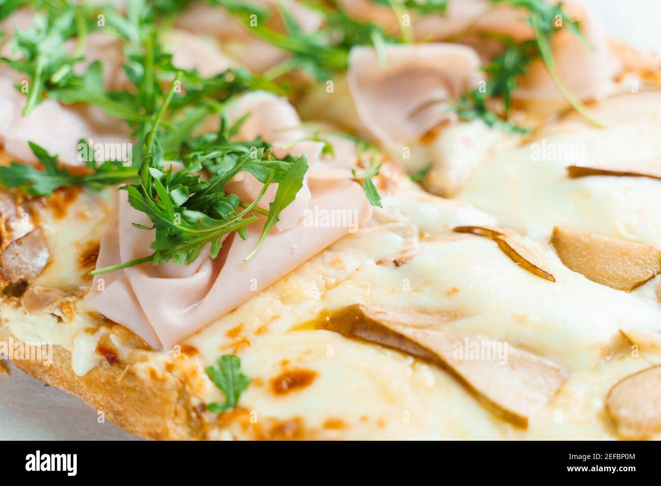 Pinsa romana with pear, cheese, prosciutto in delivery box ...