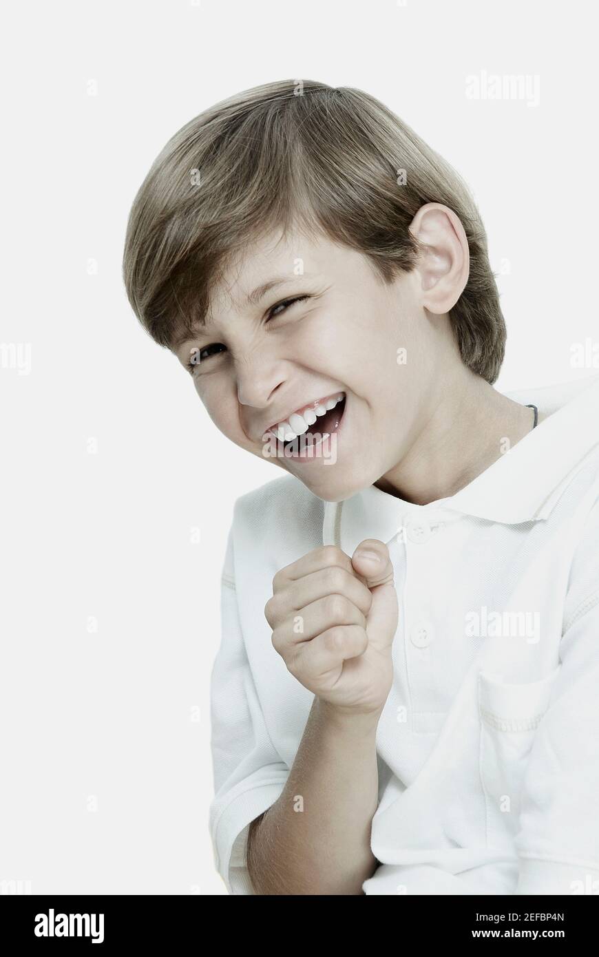 Portrait of a boy making a fist and smiling Stock Photo - Alamy