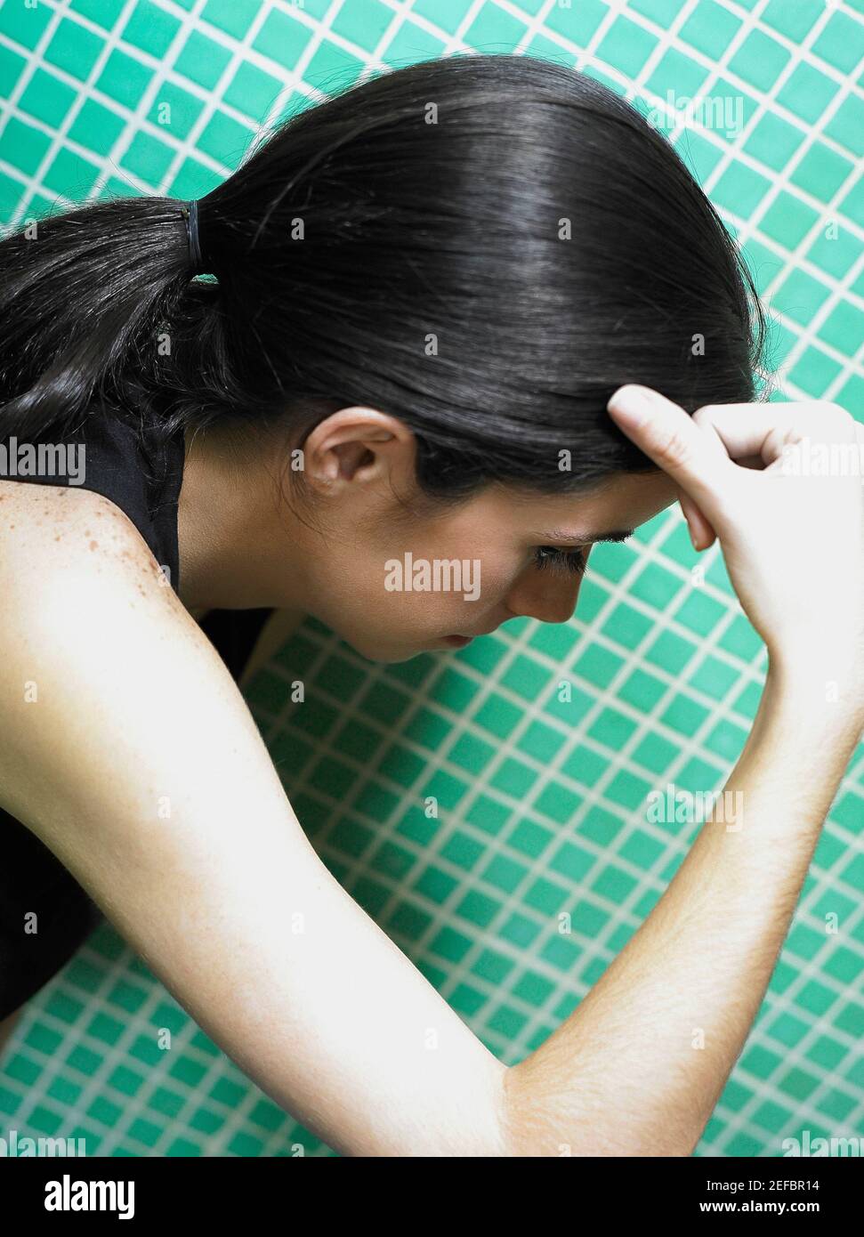 Side profile of a young woman thinking Stock Photo - Alamy