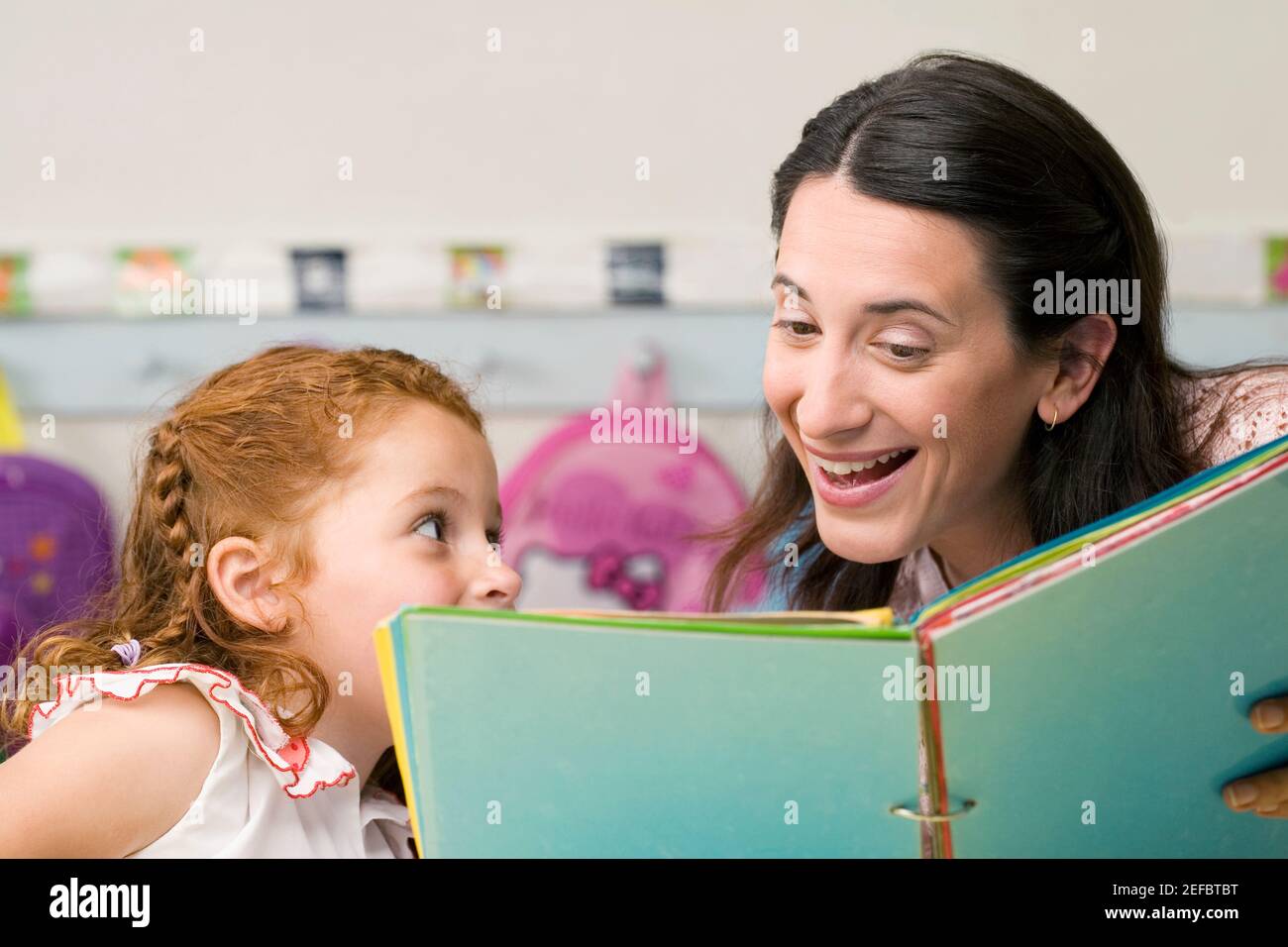 Female teacher teaching her student in a classroom Stock Photo - Alamy