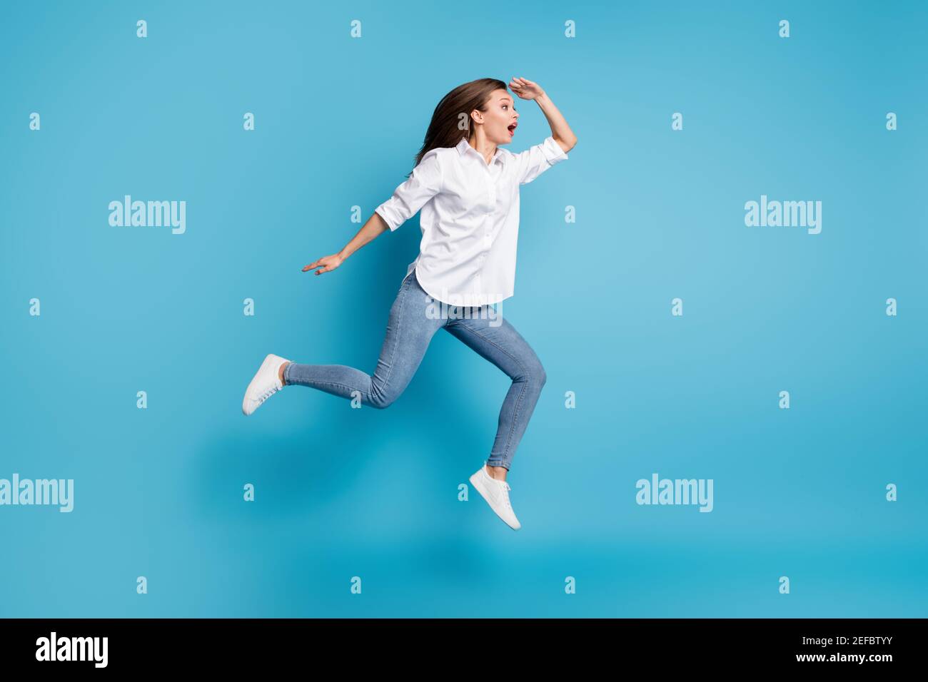 Full length photo lady jump high running look far away interested wear ...