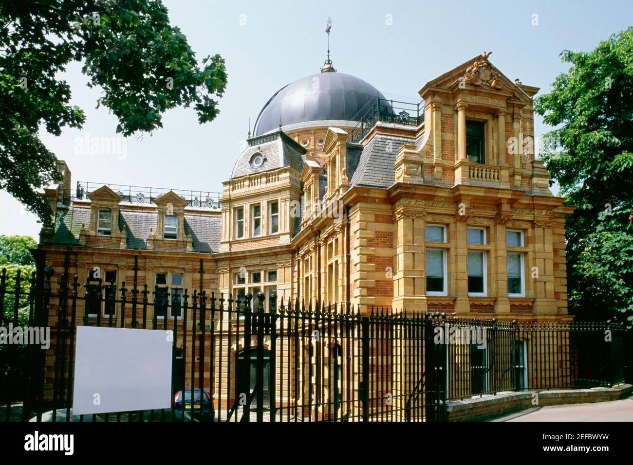 Side view of a domed building adjacent to Royal Observatory, Greenwich ...