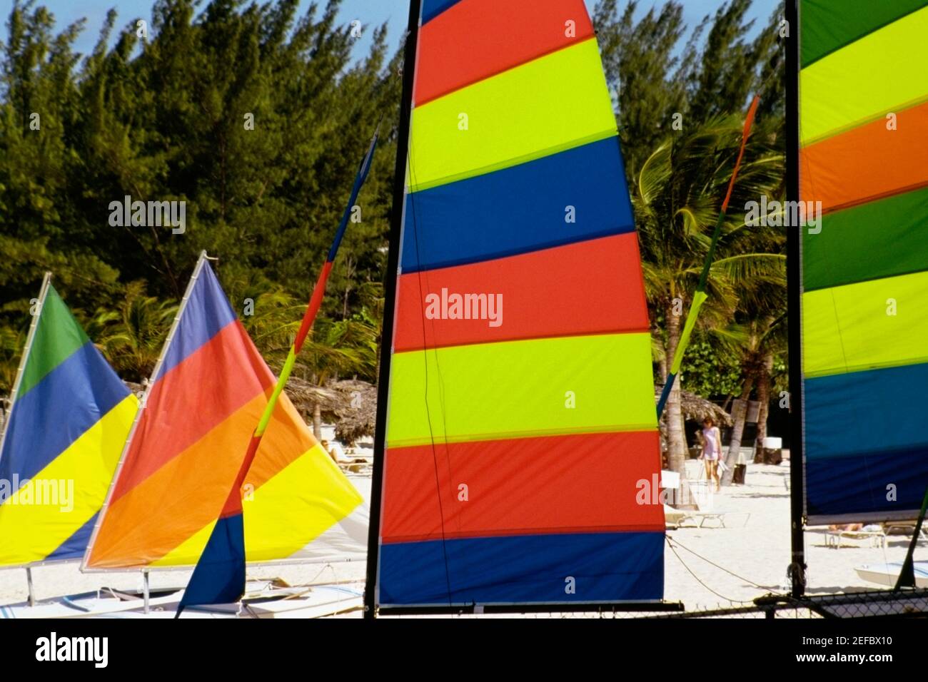 Colored sails lined up on a beach, Nassau, Bahamas Stock Photo - Alamy