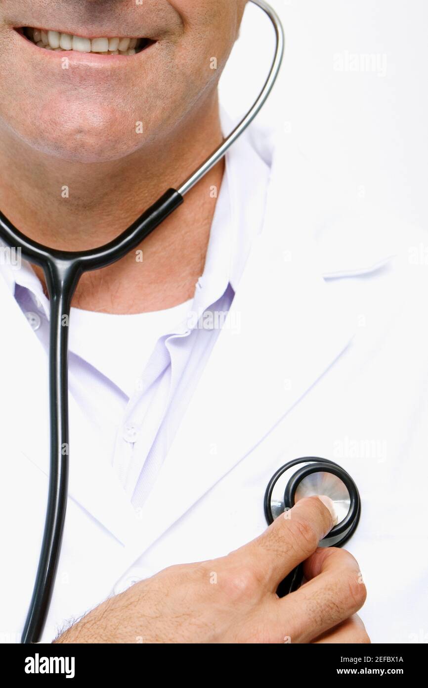 Close-up of a male doctor examining himself with a stethoscope Stock ...