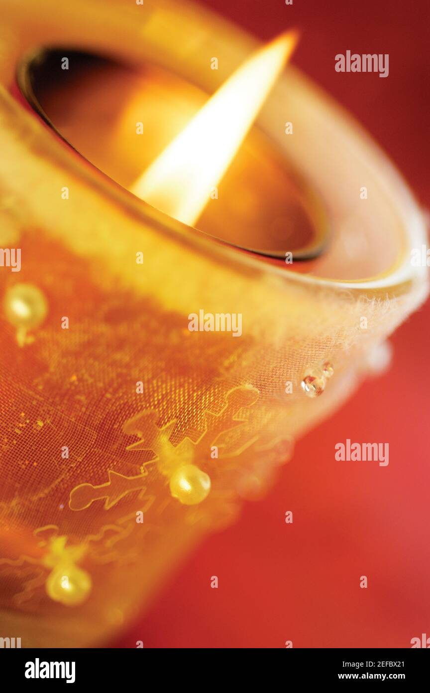 Close-up of a lit candle Stock Photo - Alamy