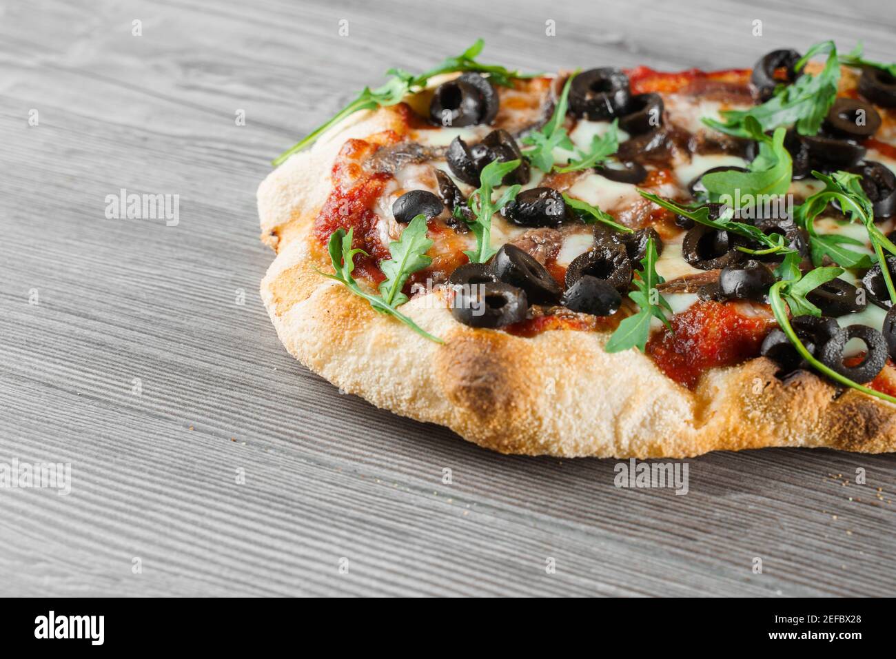 Pinsa romana gourmet italian cuisine on grey wooden background ...