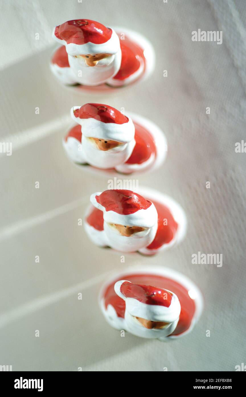 High angle view of a row of Santa Claus figurines Stock Photo - Alamy