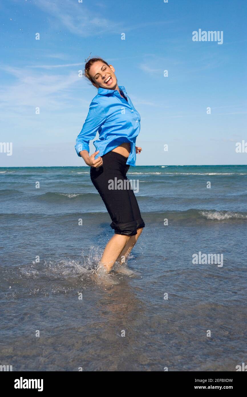Woman dancing on the beach hi-res stock photography and images - Alamy