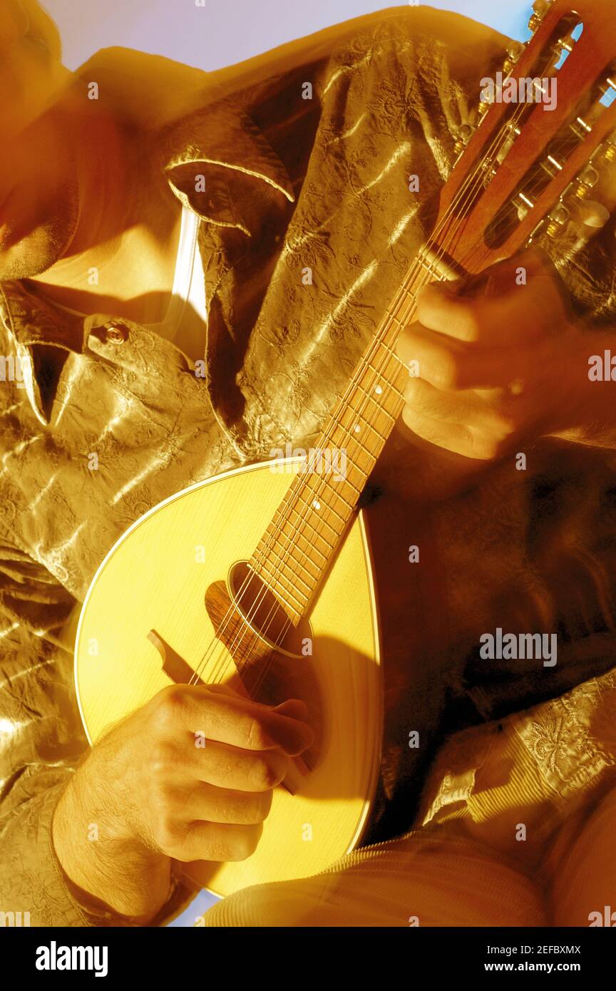 Mid section view of a musician playing the banjo Stock Photo - Alamy