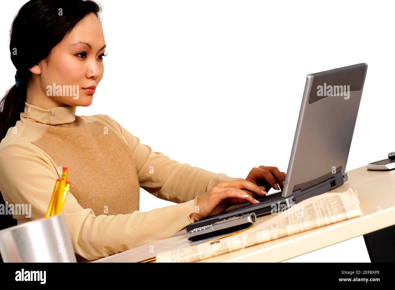 Side profile of a businesswoman using a laptop Stock Photo - Alamy