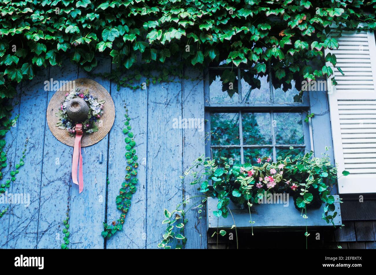Hat hanging on the door Stock Photo - Alamy