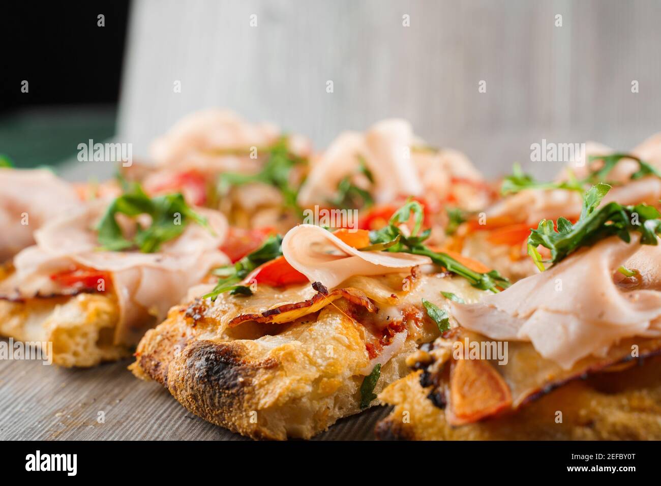 Pinsa romana cut into pieces portions for one person. Food delivery ...