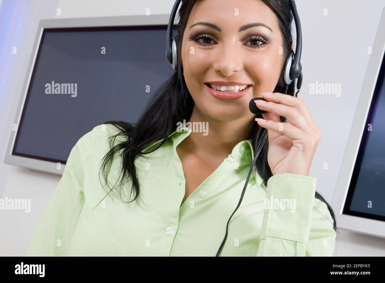 Portrait of a female customer service representative smiling Stock ...