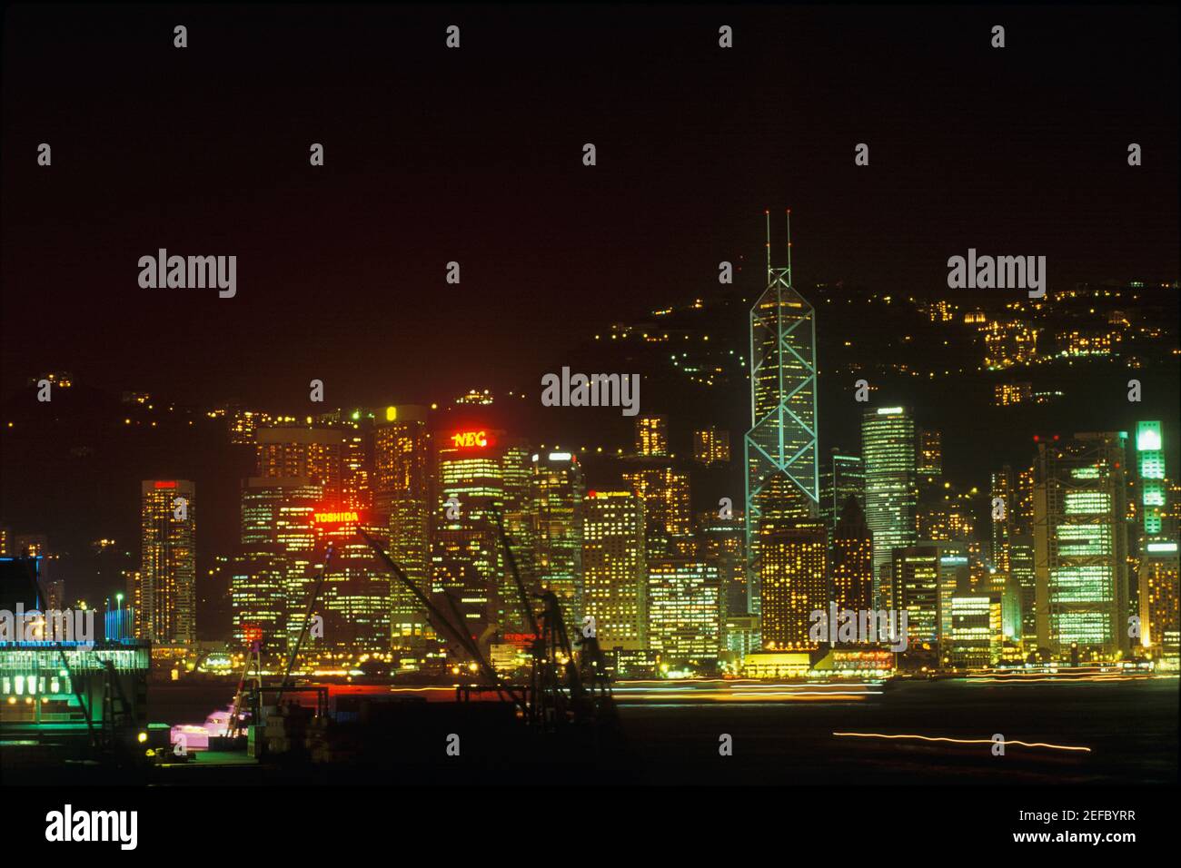 Buildings in a city lit up at night, Hong Kong, China Stock Photo - Alamy