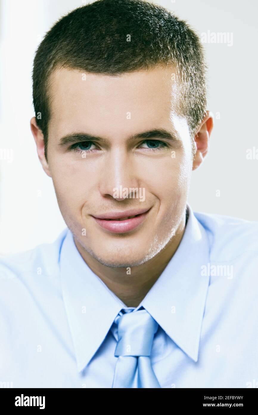 Portrait of a businessman smirking Stock Photo - Alamy