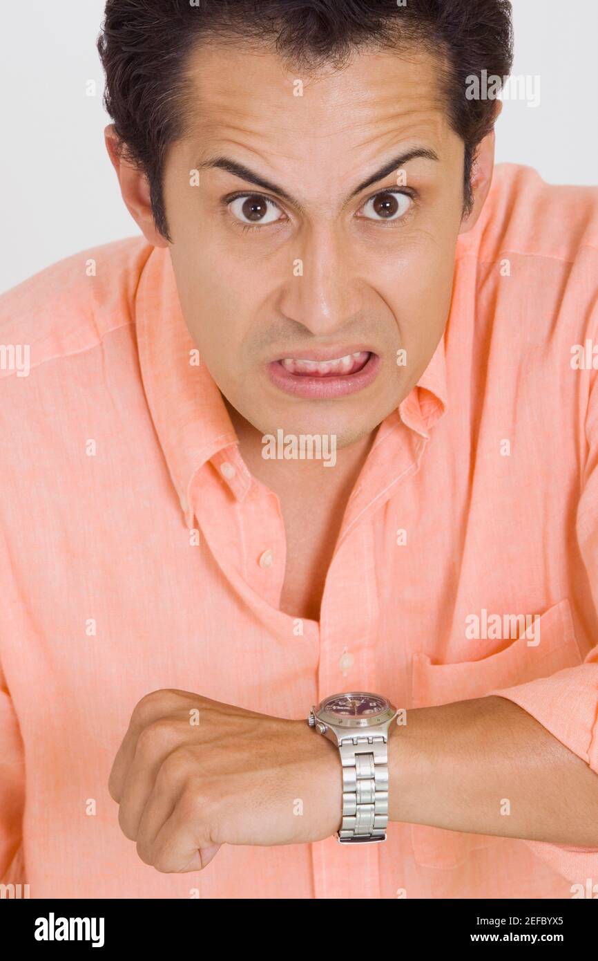 Unhappy man checking time on hi-res stock photography and images - Alamy
