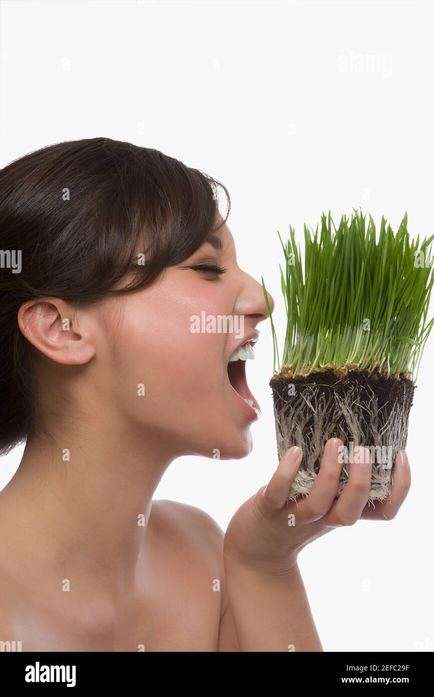 Young woman holding mouth shut hi-res stock photography and images - Alamy