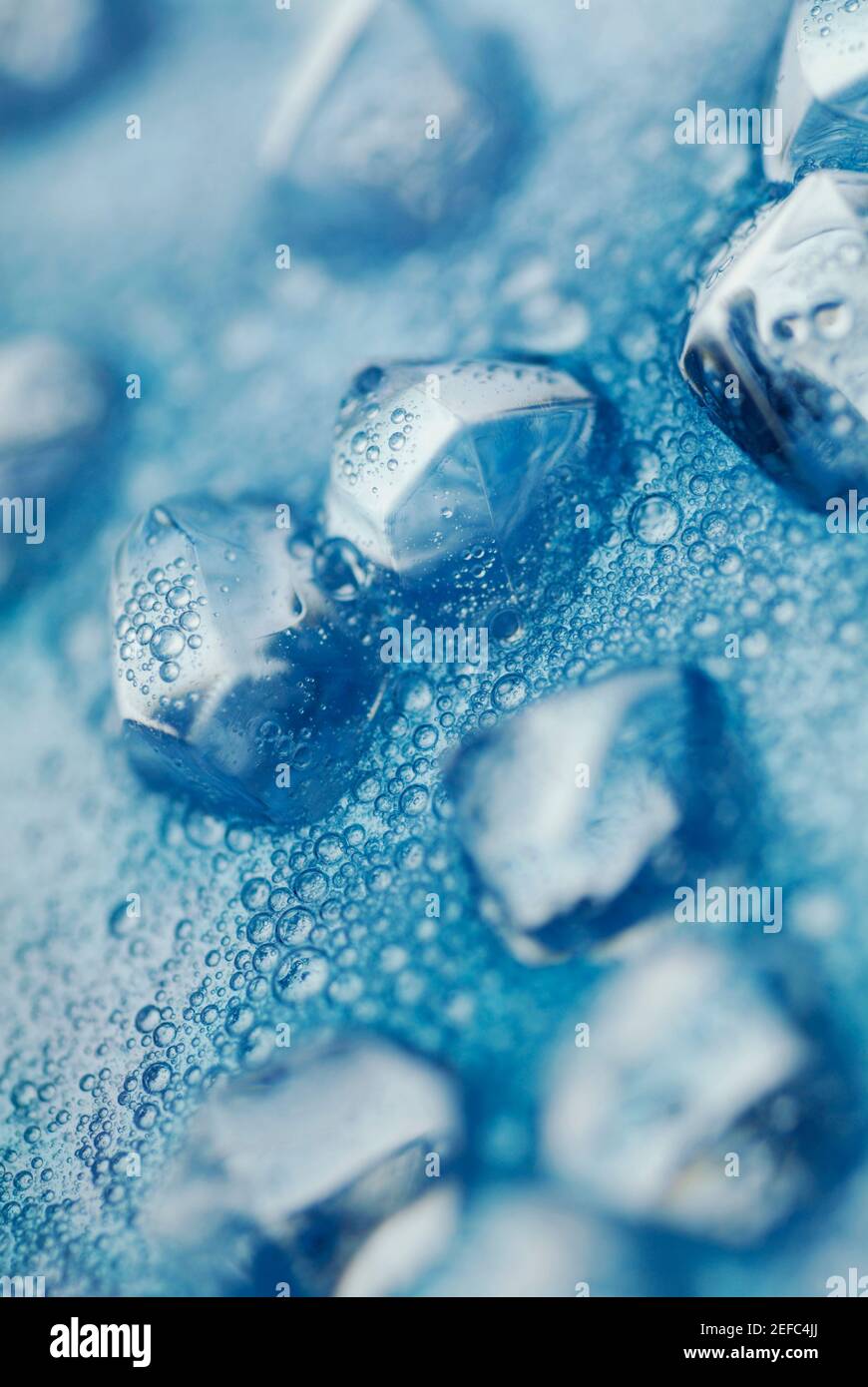 Ice cubes floating on water Stock Photo - Alamy