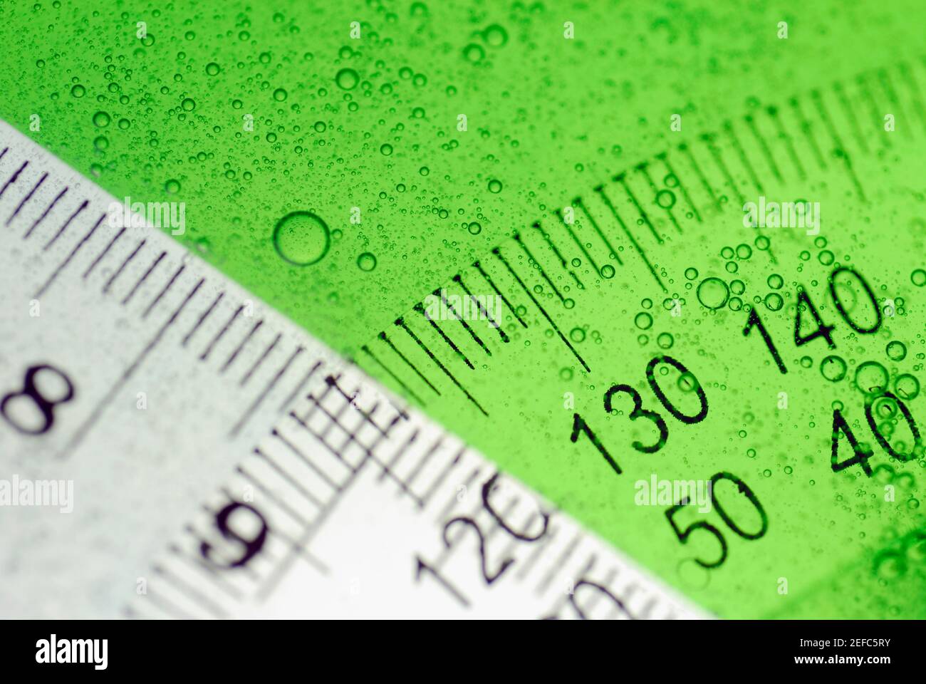 Close-up of a protractor and a ruler in water Stock Photo - Alamy