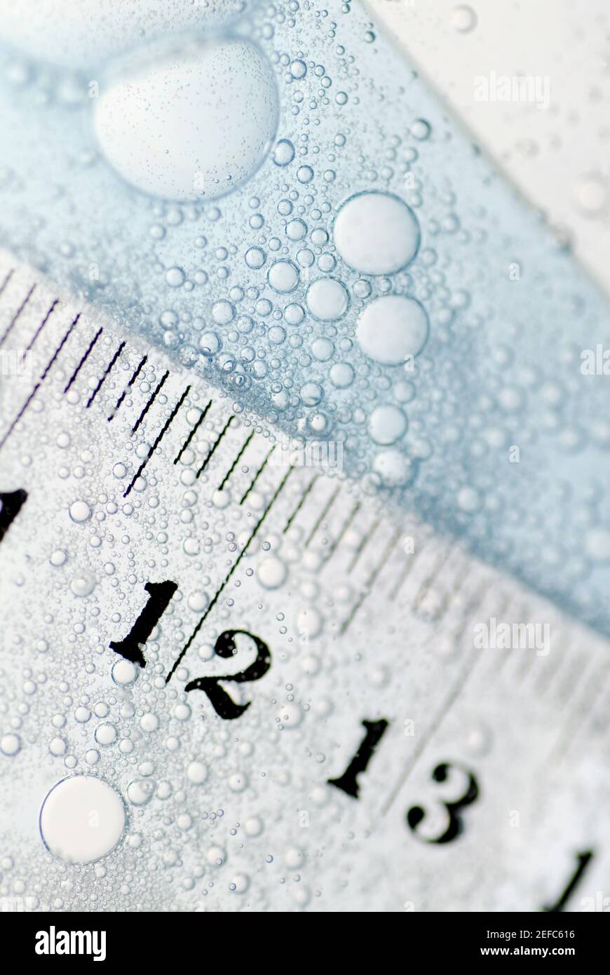 Close-up of a ruler in water Stock Photo - Alamy