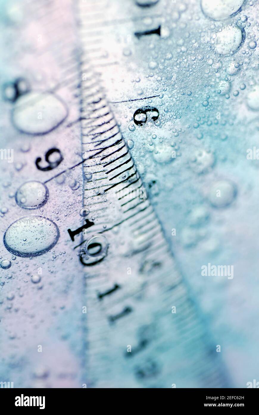 Close-up of rulers in water Stock Photo - Alamy