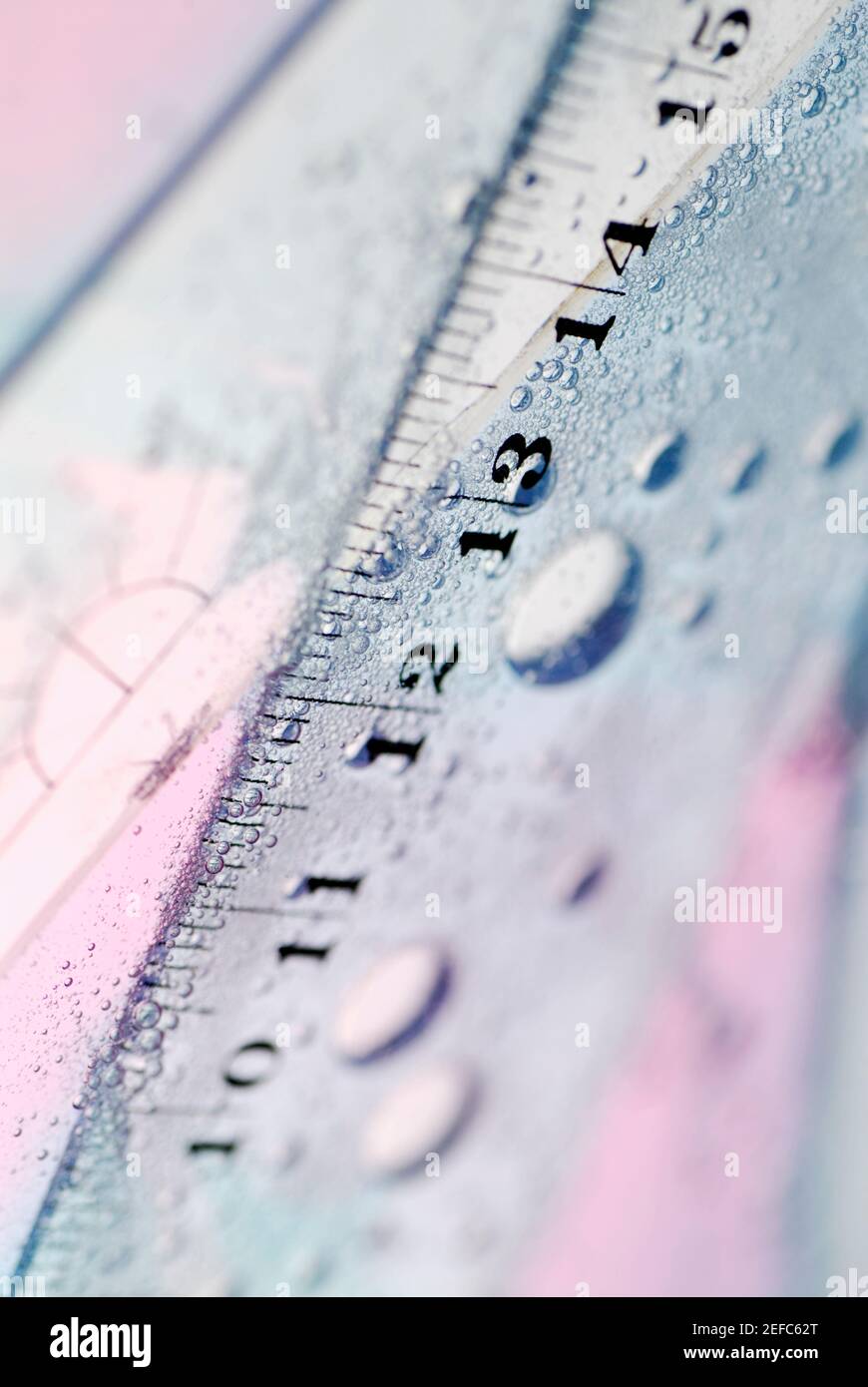 Close-up of a ruler in water Stock Photo - Alamy
