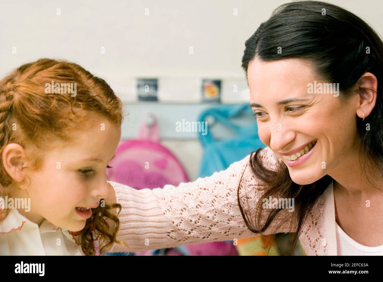 Female teacher teaching her student in a classroom Stock Photo - Alamy