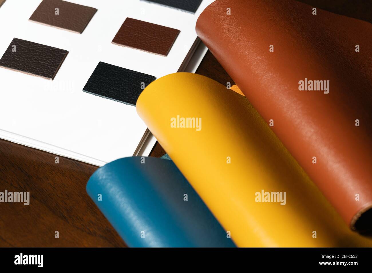 leather swatch book with various different colors and 3pieces of ...