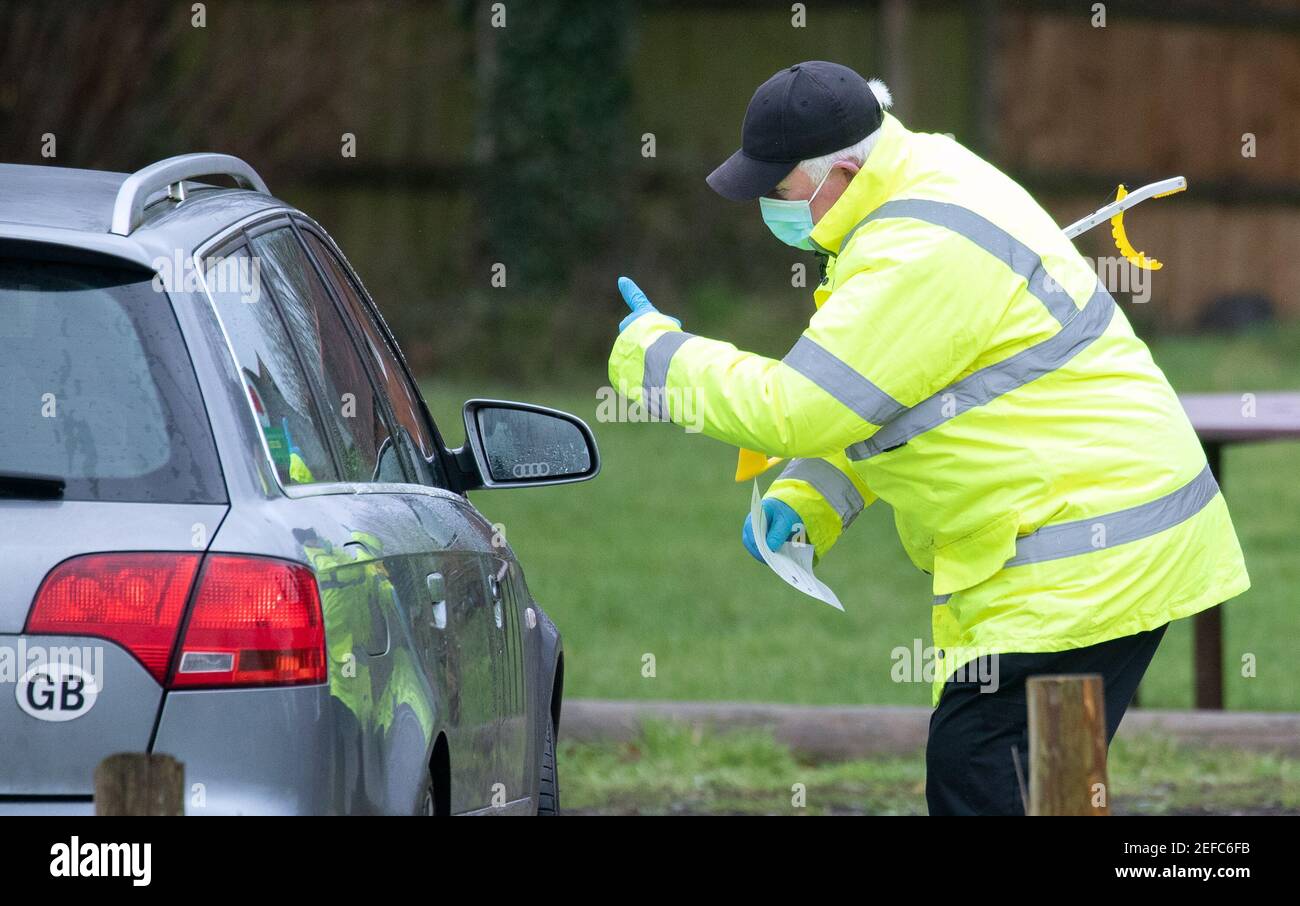 A member of NHS Track and Trace gives the thumbs up to a driver taking ...