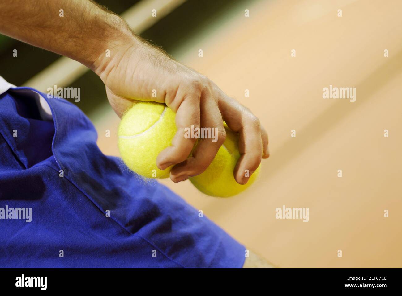 Hand holding two balls hi-res stock photography and images - Alamy