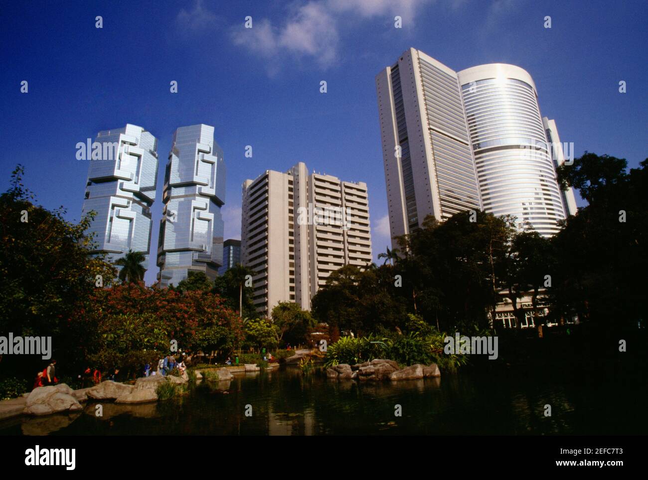 Low angle view of a park in front of buildings, Hong Kong, China Stock ...