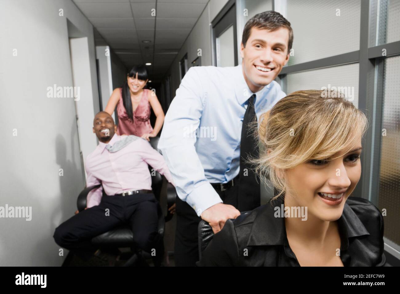 Office workers playing in an office Stock Photo - Alamy