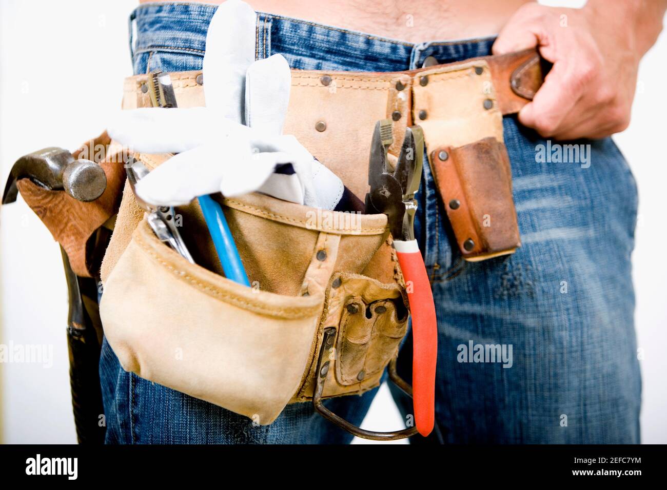 Mid section view of a man wearing a tool belt Stock Photo - Alamy