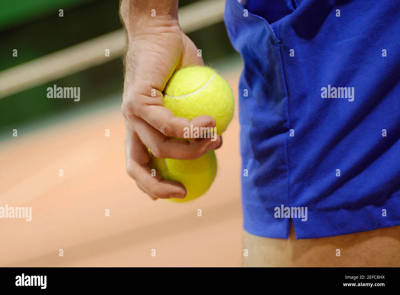 Two balls man hand hi-res stock photography and images - Alamy