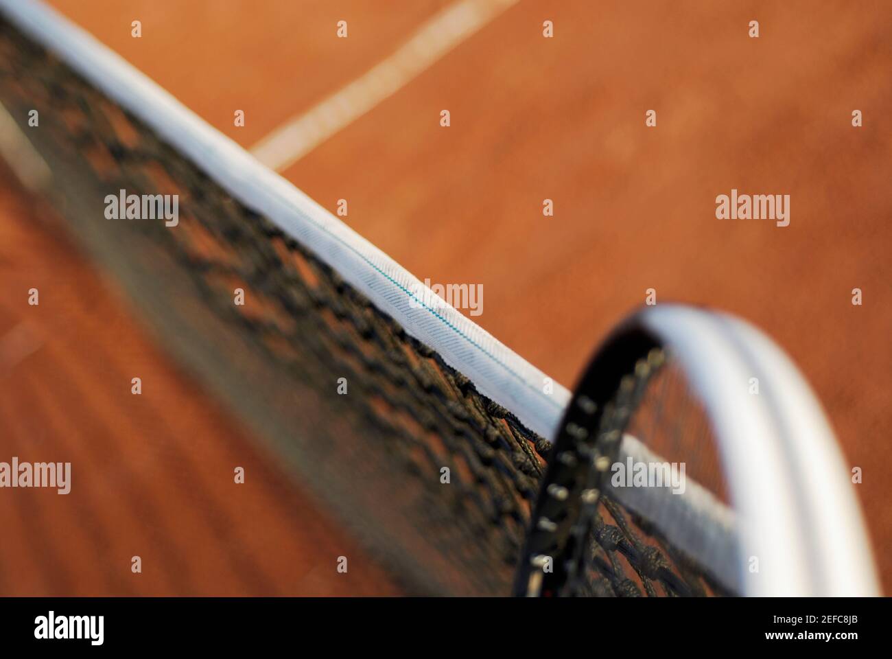 High angle view of a tennis racket and a tennis net on a tennis court ...